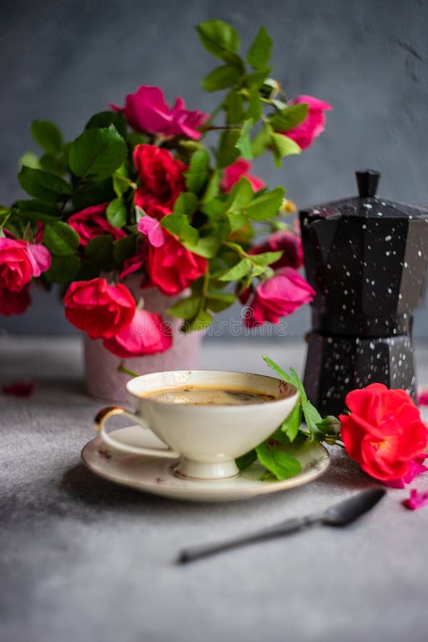Coffee time with red roses stock photo. Image of background - 148596370