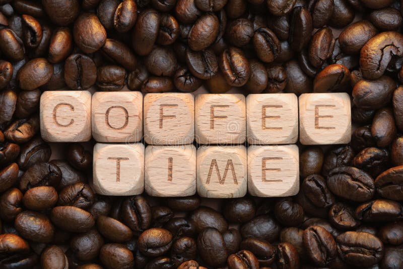Coffee Time in Wooden Blocks Surrounded by Espresso Beans Stock Photo ...