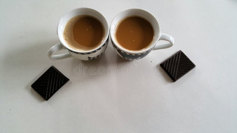 Two Coffees in Small Cups with Chocolate on the Side Stock Image ...