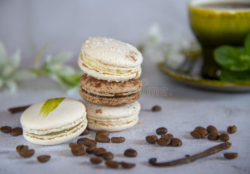Coffee and Vanilla Macaroon are Stacked in a Pyramid on a Gray ...
