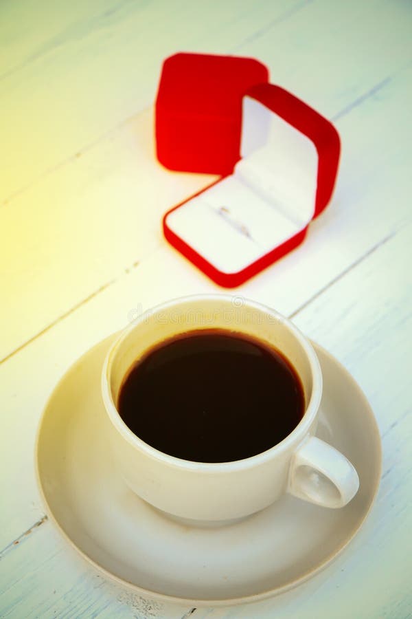Coffee with wedding ring stock image. Image of design - 87724725