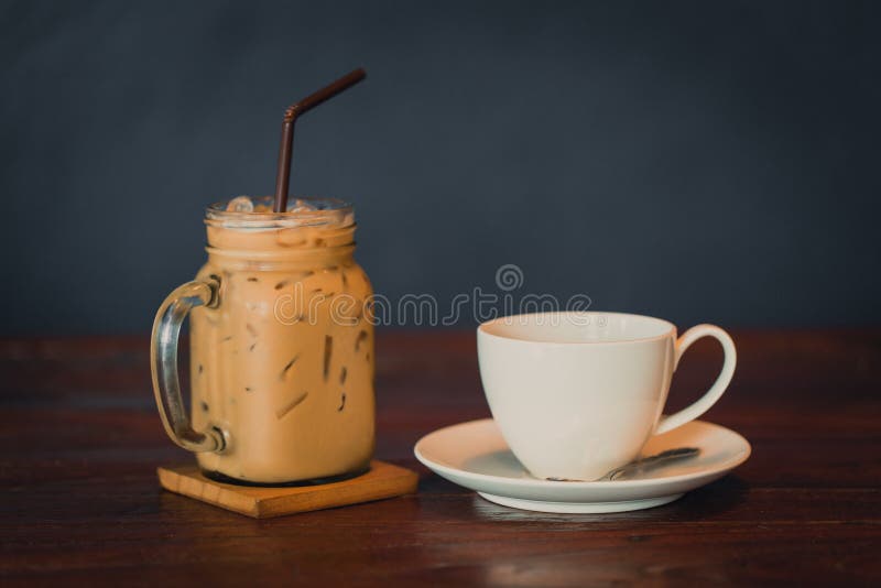 Coffee on Wood Table Ice and Hot Stock Photo - Image of cold, latte ...