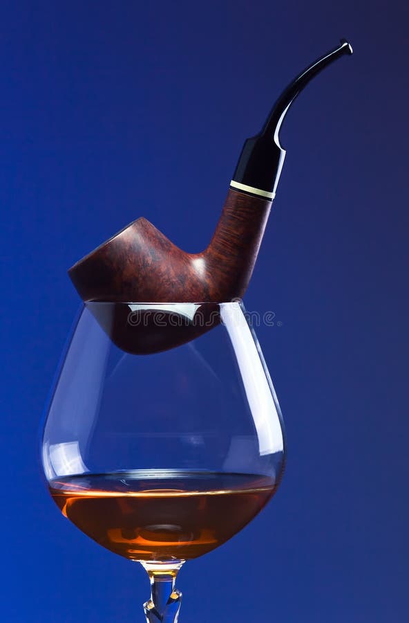 Cognac and pipe stock image. Image of snifter, blue, liqueur - 25121357