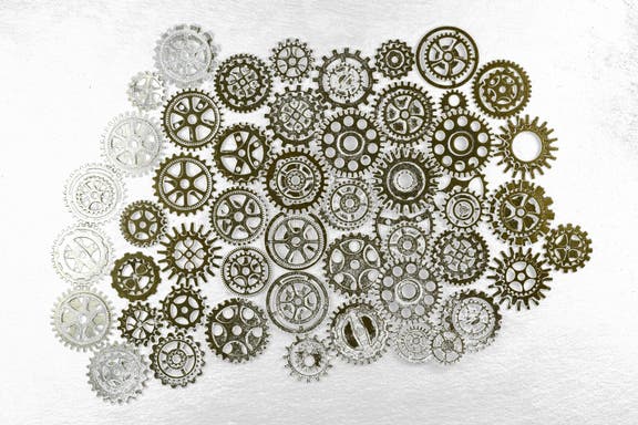 Cogs and Gear Wheels Arranged on Slate Rock Background Showing Textures ...