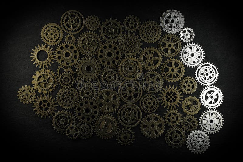 Cogs and Gear Wheels Arranged on Slate Rock Background Showing Textures ...