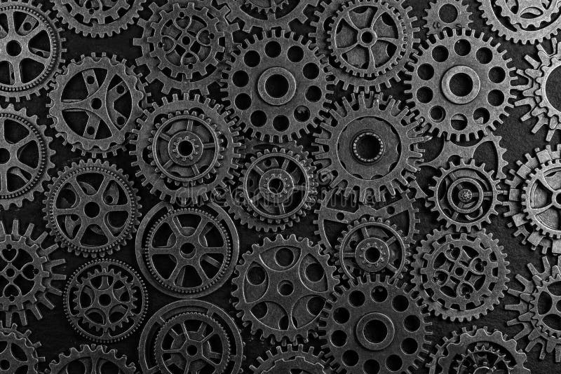 Cogs and Gear Wheels Arranged on Slate Rock Background Showing Textures ...