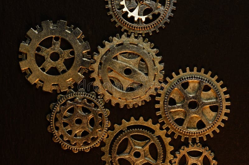 Cogs and Gear Wheels Arranged on Slate Rock Background Showing Textures ...
