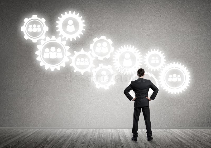 Cogwheel Engine Drawn on Concrete Wall As Symbol for Teamwork and ...