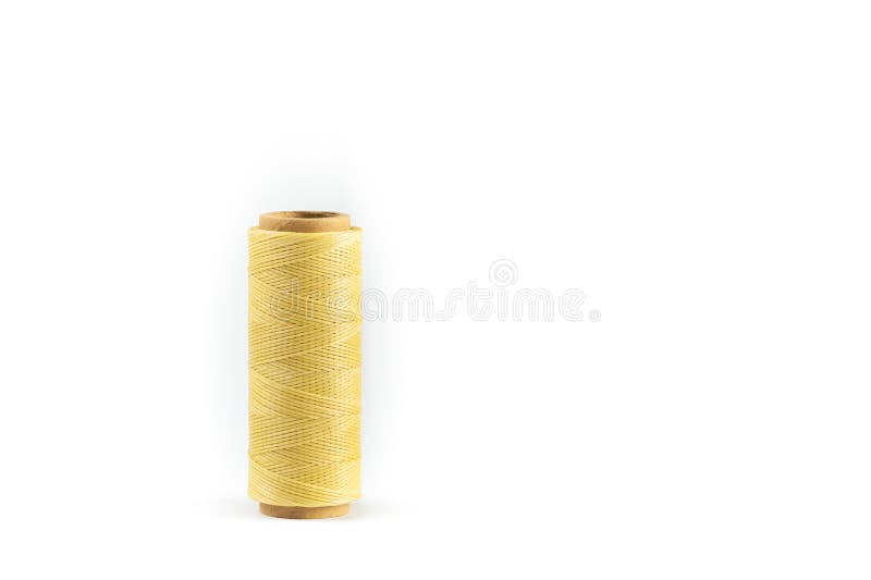 A Coil of Beige Thread. Spool of Colored Threads on a White Background ...