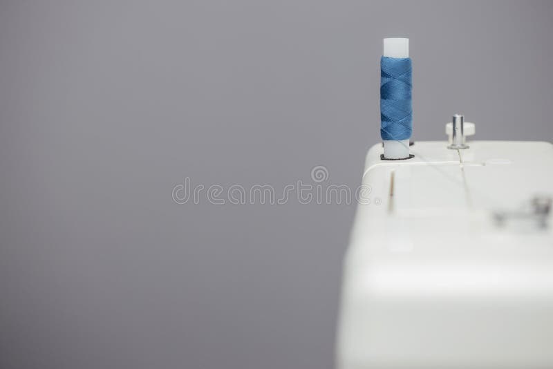 Coil with Blue Threads Installed on a Sewing Machine Stock Photo ...