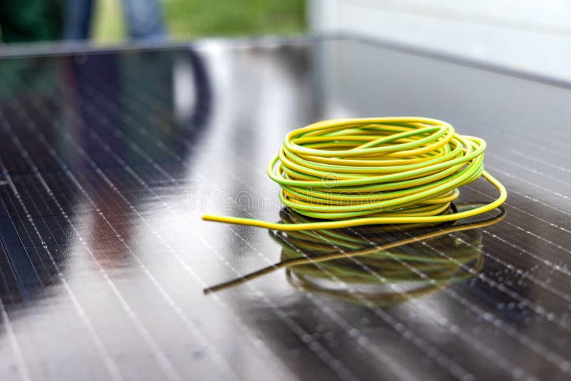 A Coil of Electric Cable Sitting on a SolarPanel Stock Photo - Image of ...