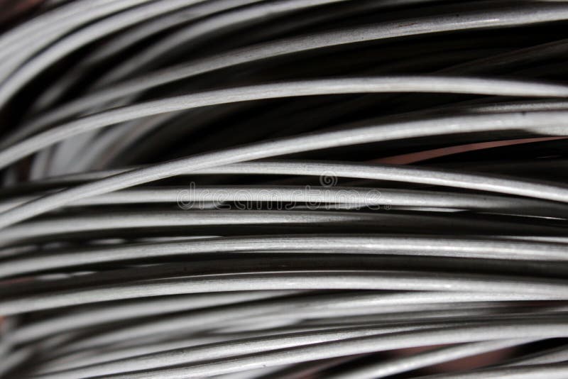 A Coil of Fechral Thick Refractory Wire Hangs in a Warehouse of Goods ...