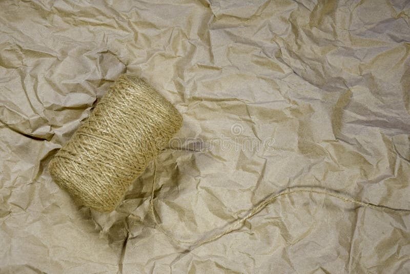 Coil of Hemp Twine on Crumpled Wrapping Paper. Top View. Background ...