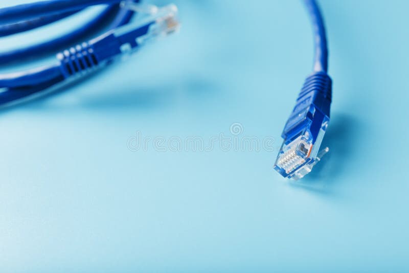 A Coil of an Internet Network Cable for Data Transmission on a Blue ...
