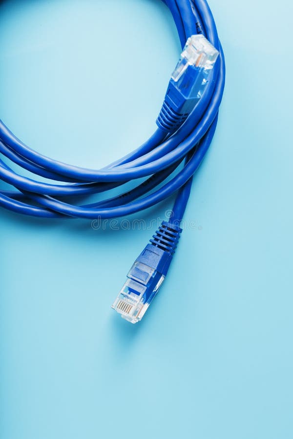 A Coil of an Internet Network Cable for Data Transmission on a Blue ...