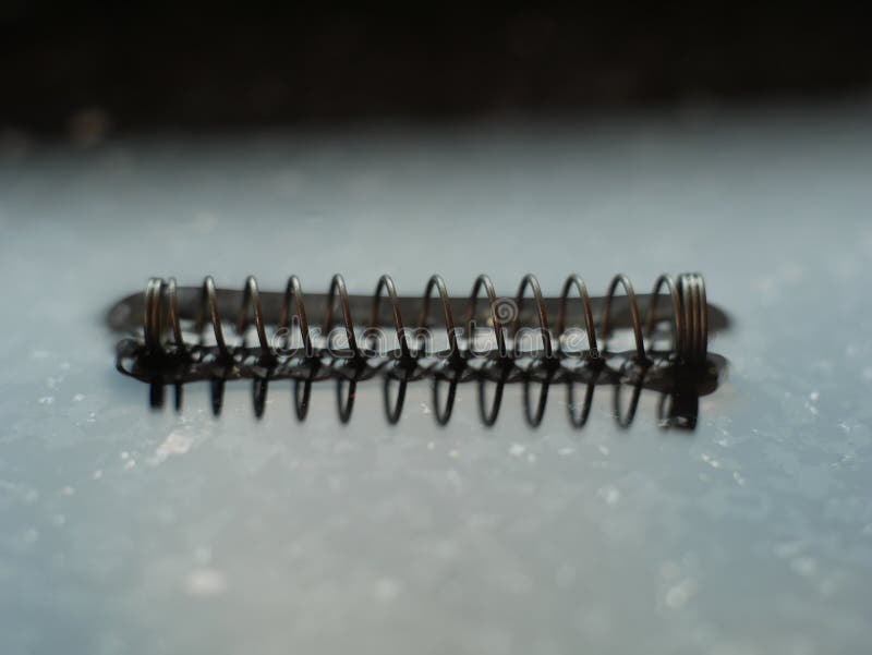 A Coil Spring From A Ballpoint Pen On Abstract Background Stock Photo ...
