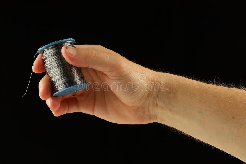 Coil of Thin Steel Iron Wire in Hand Stock Image - Image of white, iron ...
