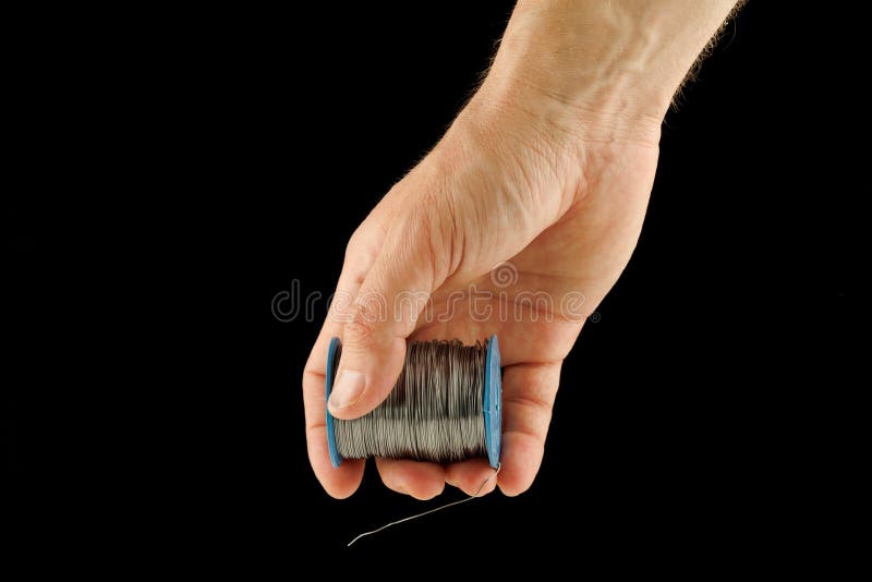 Coil of Thin Steel Wire on Cloth Background Stock Photo - Image of ...