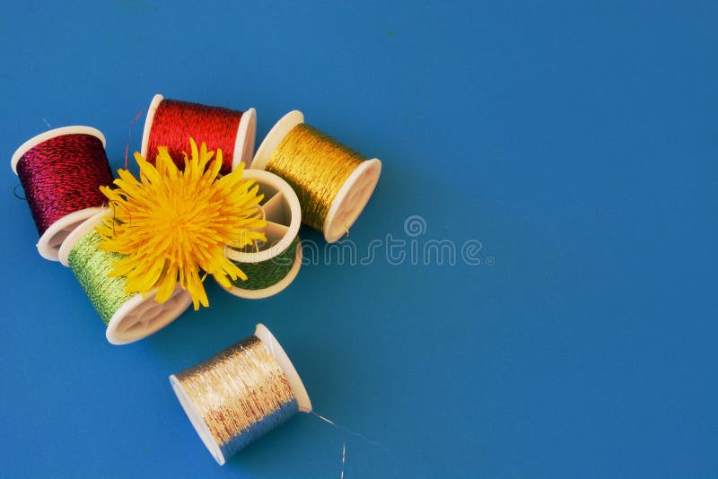 Coil of Thread and Dandelion Stock Photo - Image of yellow, table: 92727598