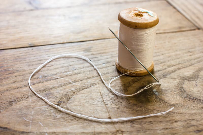 Coil with White Threads and a Needle Stuck Stock Image - Image of ...
