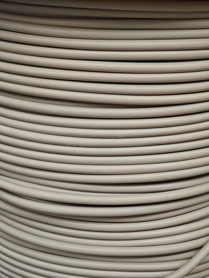 Coiled Beige Cable Rolls Stacked Neatly in a Storage Area during ...