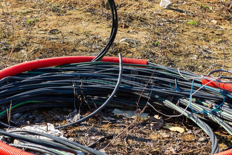 Coiled Cables and Wires Laying on Ground Surface, Ready for Use in ...