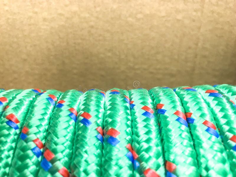 Coiled Nylon Rope Close Up Against Brown Cardboard Stock Photo - Image ...