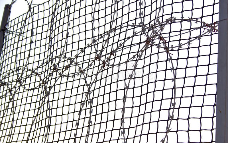 Coiled Razor Wire on an Bonnex Fence Stock Image - Image of crime ...