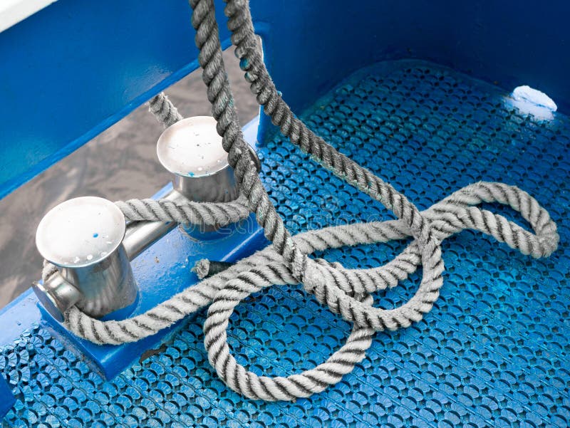 Coiled Rope on a Blue Sailing Boat Deck. Sailing Equipment Aboard Ship ...