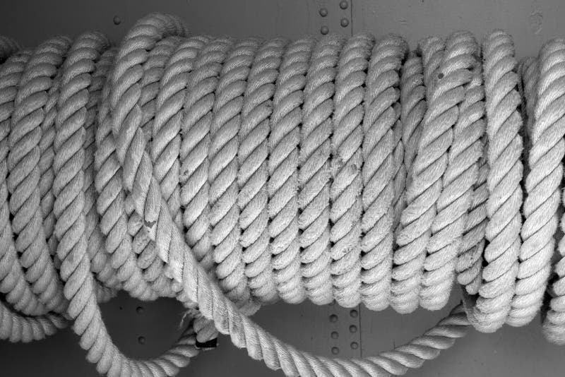 A coiled rope on the ship stock photo. Image of surround - 77005574