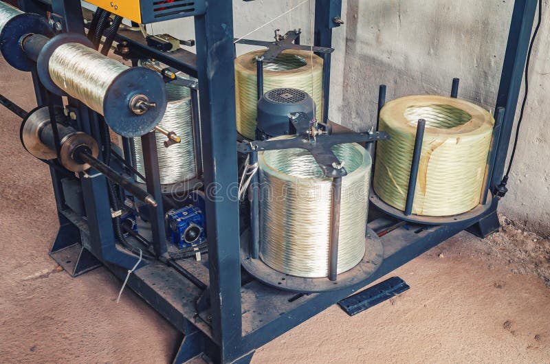 Coils of Plastic Wire in Workshop. Spinning and Winding of Plastic ...
