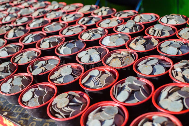 A coin in a bowl stock image. Image of metal, asia, golden - 106572481