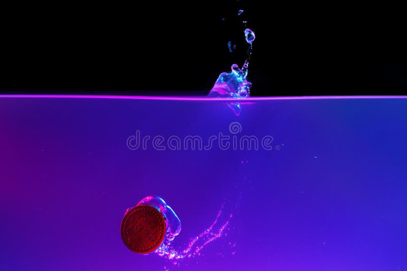 Coin Falling into the Water Against Black Background in Neon Light ...