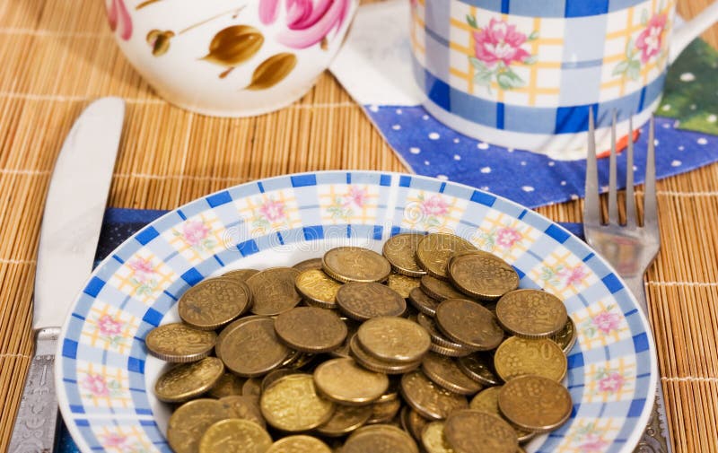 Coin money on a plate stock photo. Image of cent, cutlery - 17925650