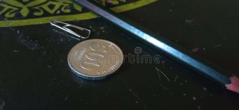 Coin, Paper Clip, Pencil,and Tabel Stock Photo - Image of clip, coin ...