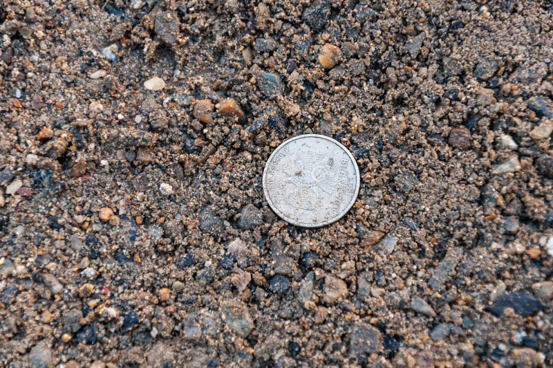 Coin on the Sand Closeup Background. Silver Coloured Ruble Stock Image ...