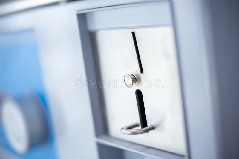 Coin Slot of Coin Laundry Vending Machine, Coin Inserting by Hand Stock ...