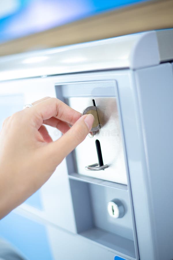 Coin Slot of Coin Laundry Vending Machine, Coin Inserting by Hand Stock ...