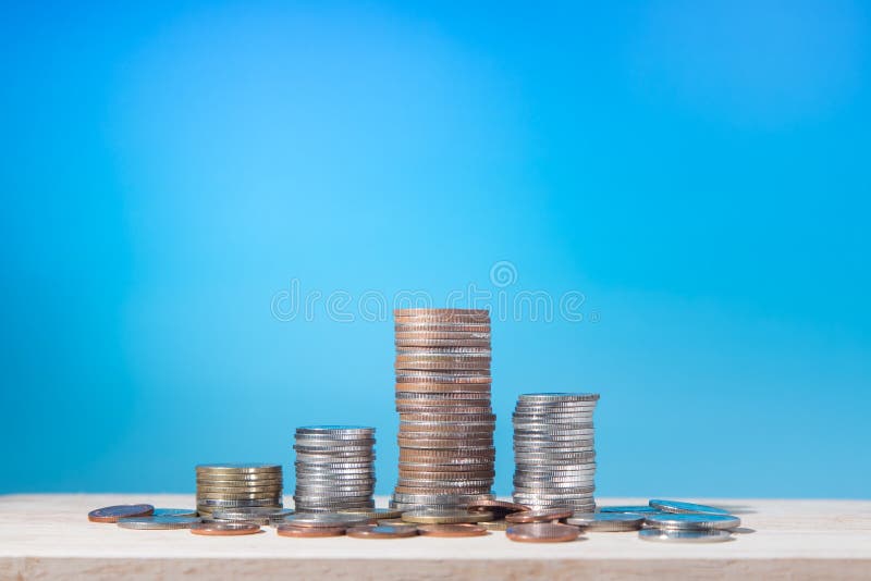 Coin Stacks with a Blue Sky Background Stock Photo - Image of light ...