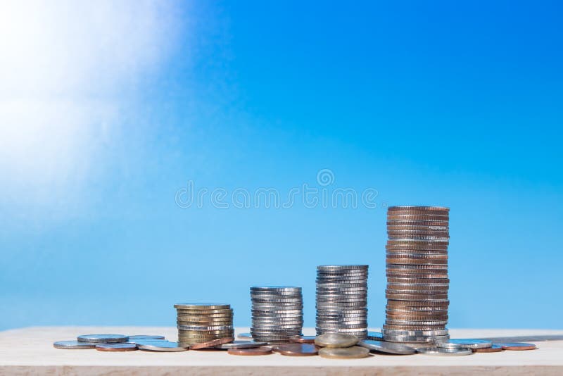 Coin Stacks with a Blue Sky Background Stock Image - Image of growth ...