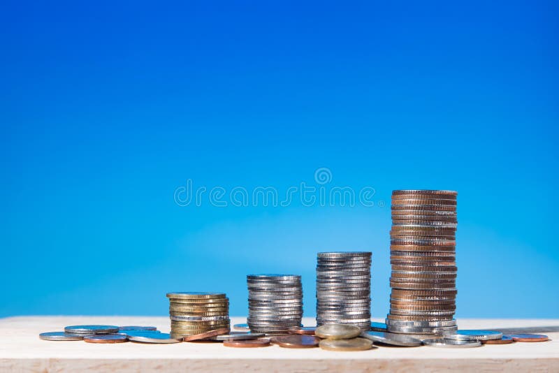 Coin Stacks with a Blue Sky Background Stock Photo - Image of bank ...