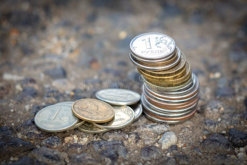 Coins on the asphalt road stock photo. Image of bank - 179371934