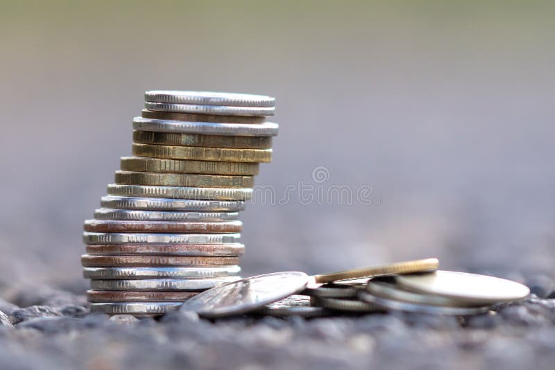 Coins on the asphalt road stock photo. Image of bank - 179371934