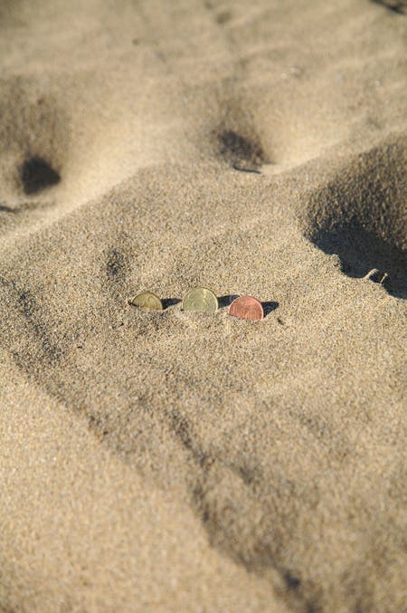 Coins at the beach stock image. Image of three, treasury - 5999003