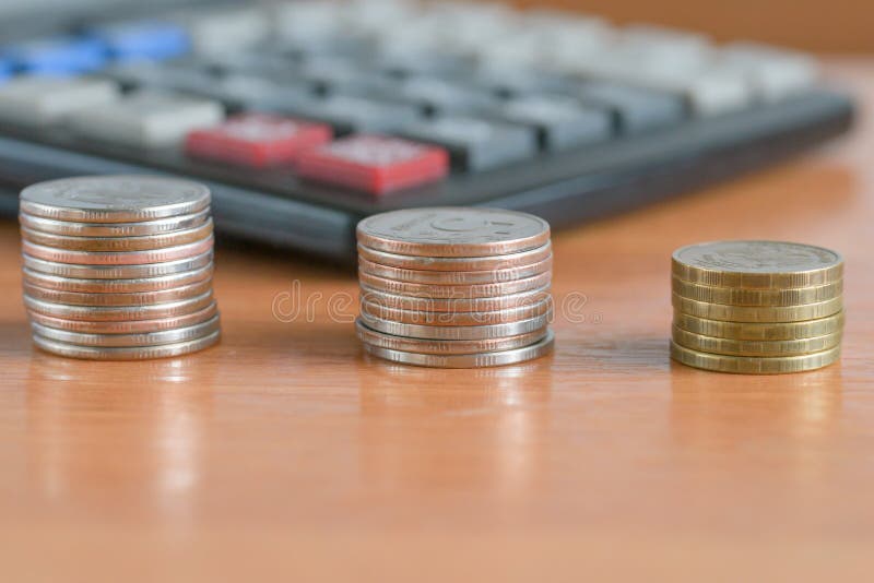 Coins and Calculator on the Table Surface. Stock Image - Image of ...