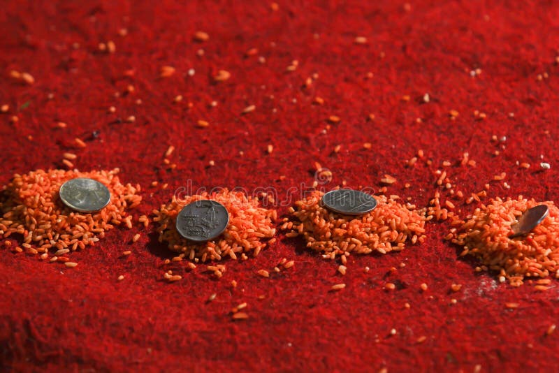 Coins on Colored Rice Grains Stock Photo - Image of grains, wedding ...