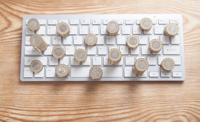 Coins on the Computer Keyboard Stock Photo - Image of currency ...