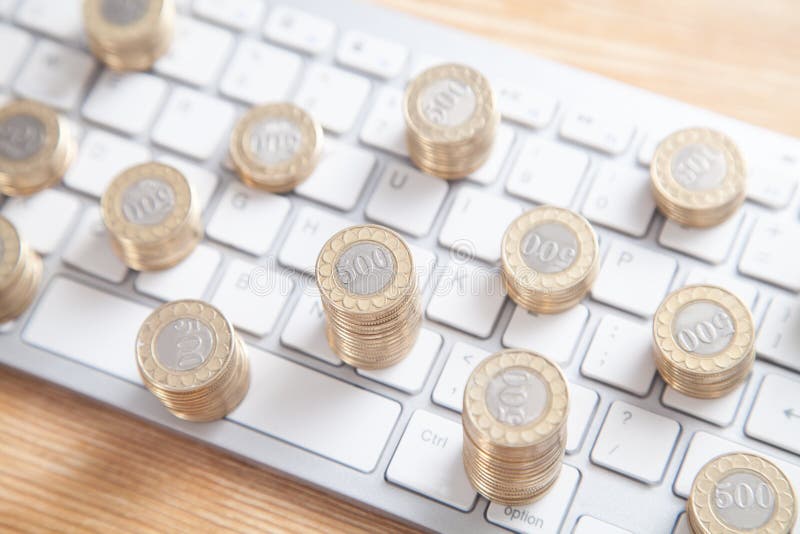 Coins on the Computer Keyboard Stock Photo - Image of profit ...