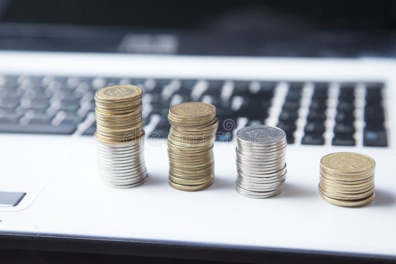 Coins on Computer Keyboard in Office Table Stock Photo - Image of ...