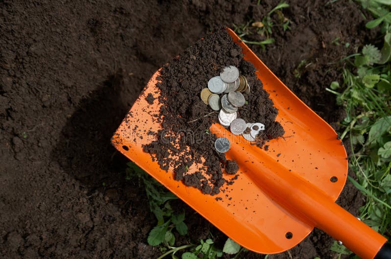 Coins Dug Out of the Ground. Concept of Treasure Finding Stock Photo ...